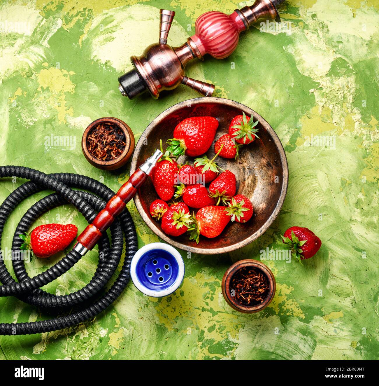 East smoking shisha with tobacco with strawberry flavor Stock Photo - Alamy
