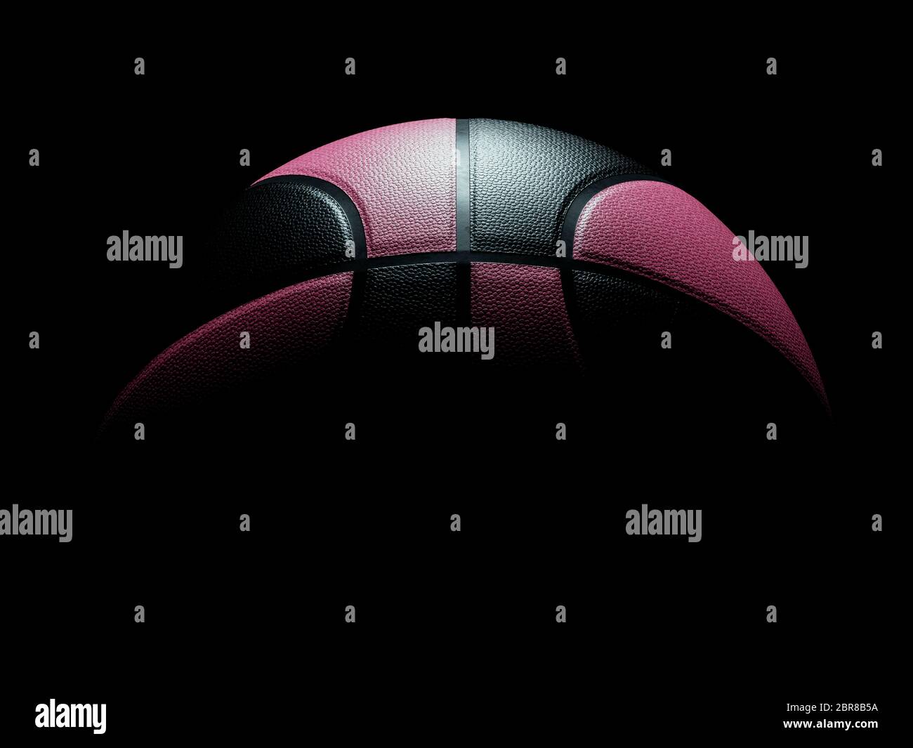 Pink and black colored single basketball for women or men sitting on ...