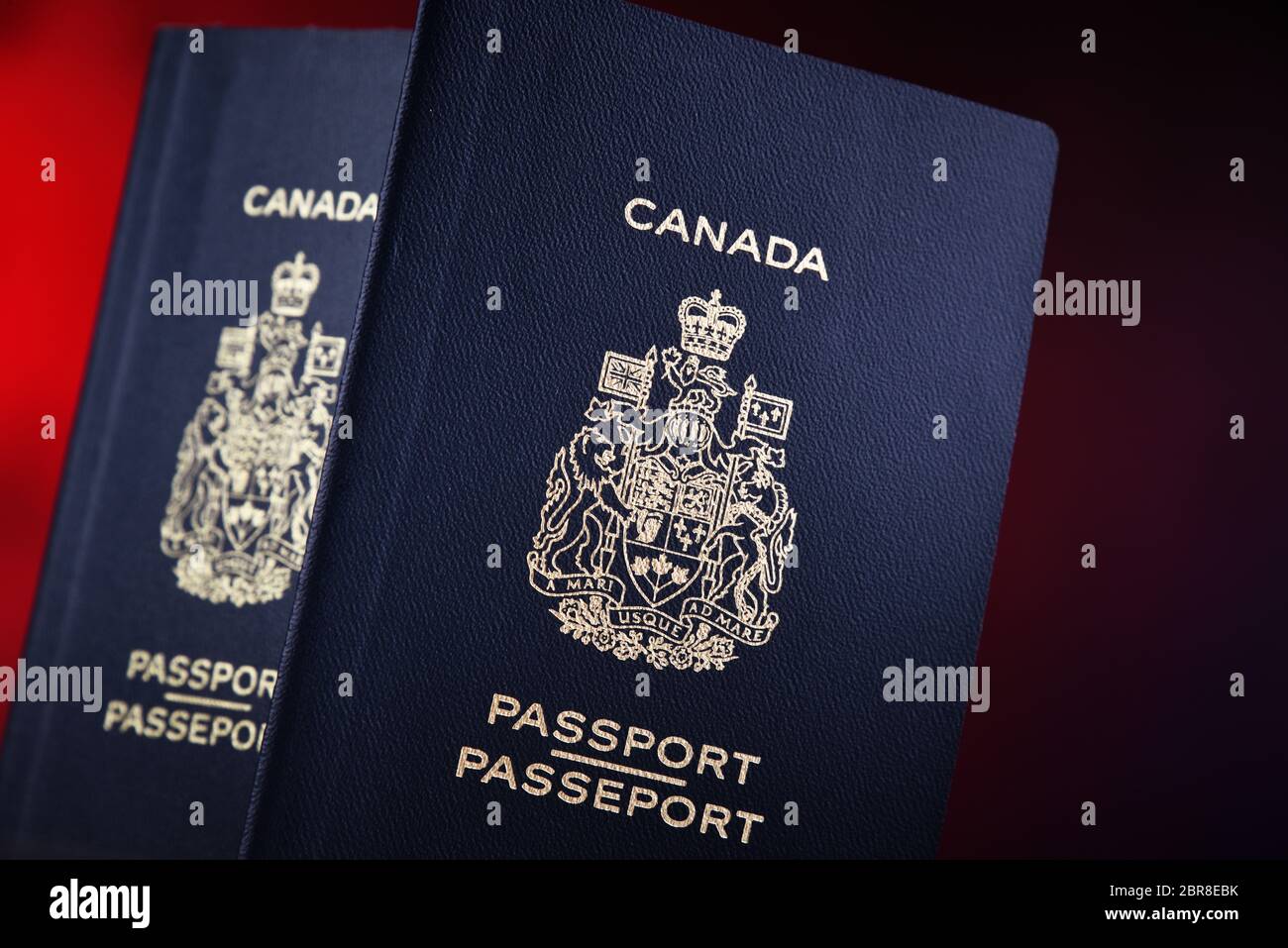 Composition with two Canadian passports Stock Photo - Alamy