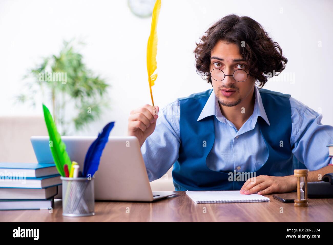 The young writer working on his new work Stock Photo - Alamy