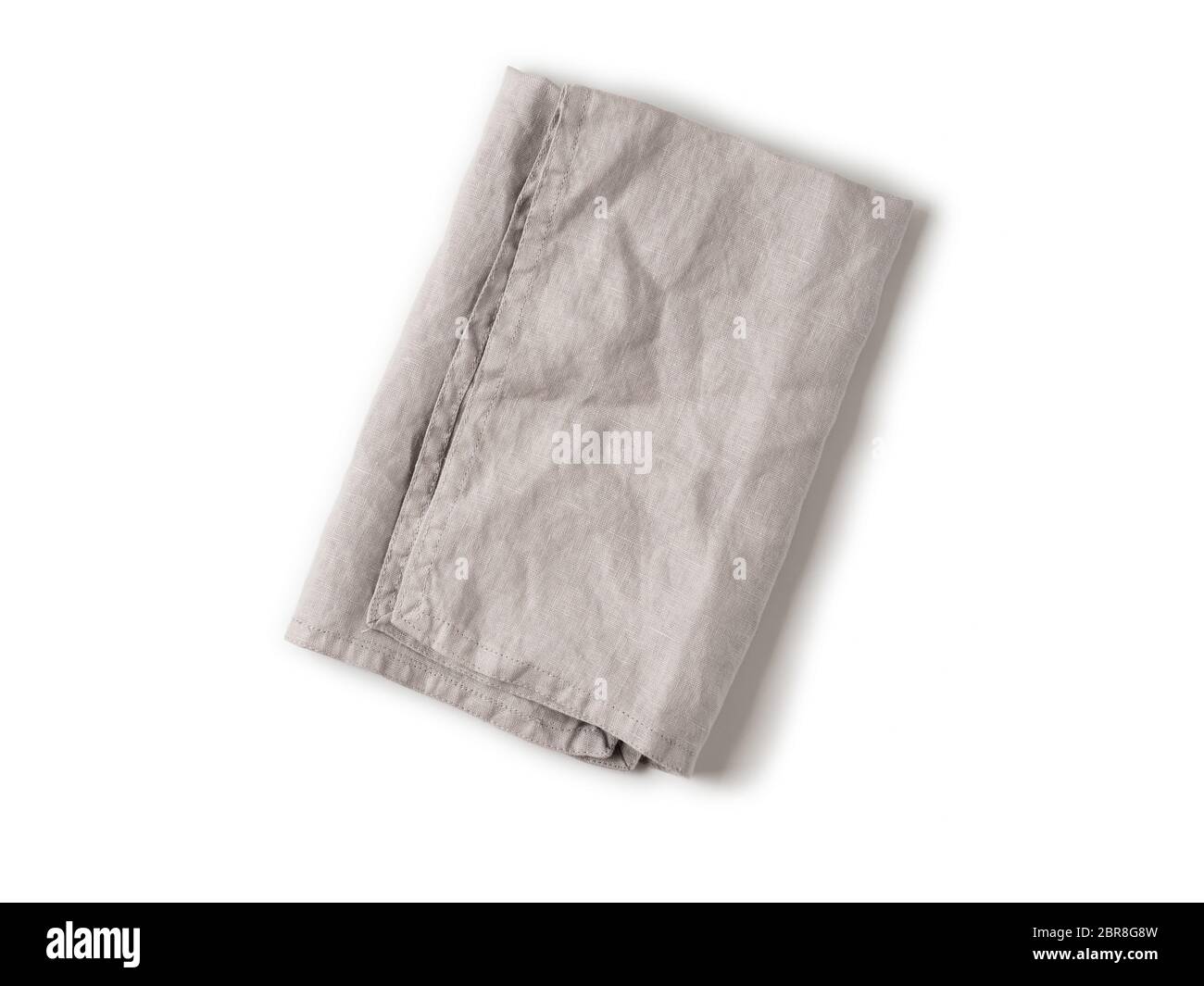 Folded gray linen napkin isolated on white background. Natural light ...