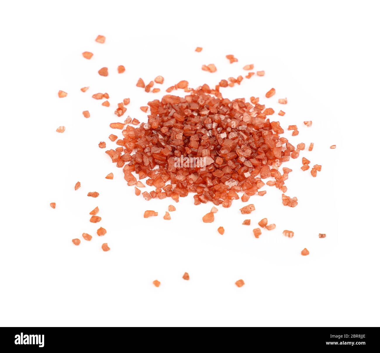 Close up one portion, heap of crystals red Hawaiian salt isolated on ...