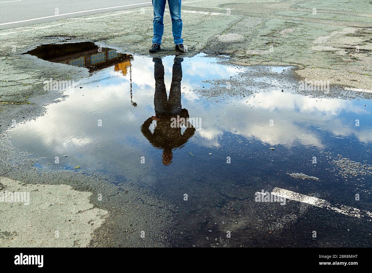 Puddle on pavement hi-res stock photography and images - Alamy