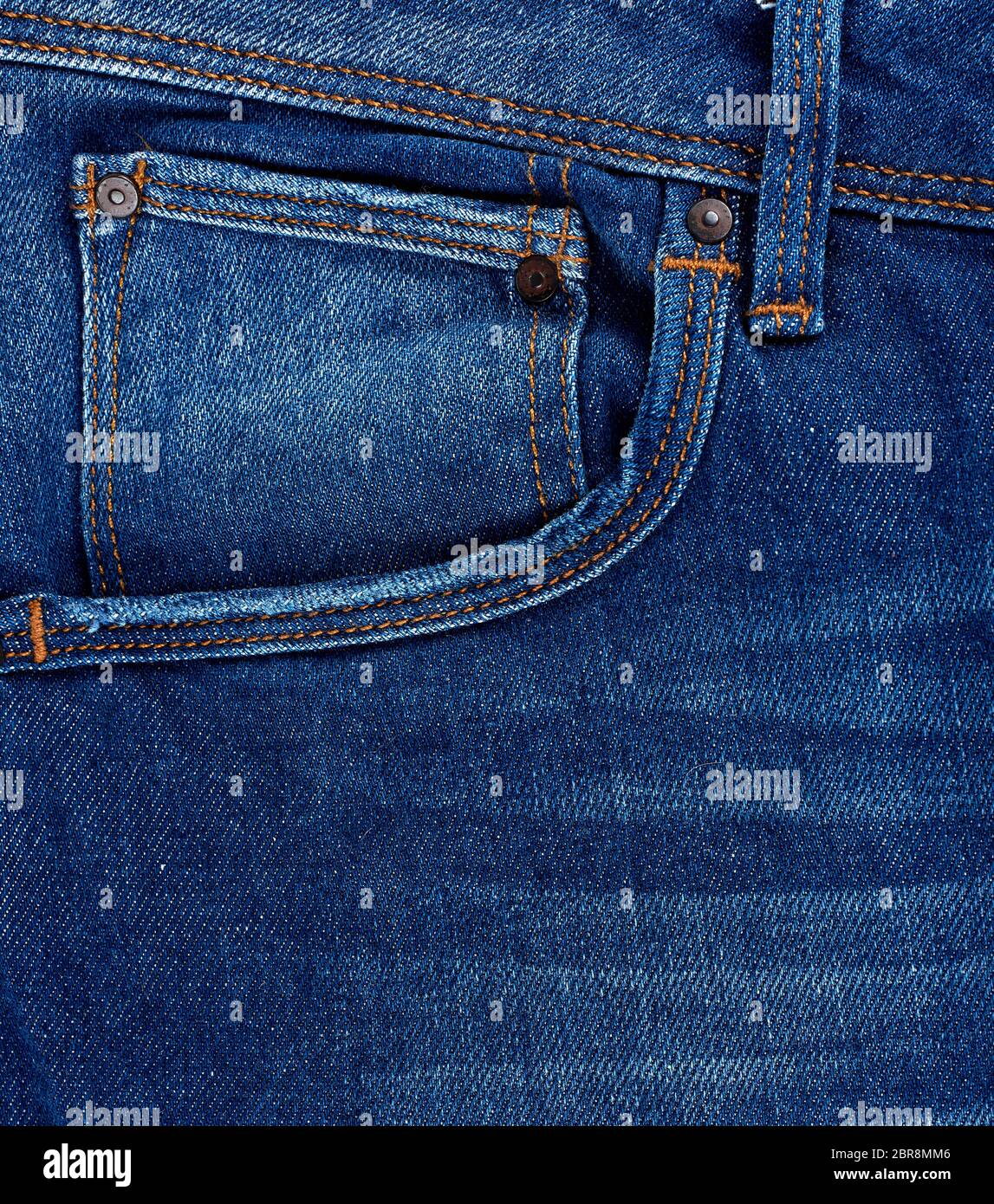 front pocket of blue classic jeans, full frame, close up Stock Photo ...