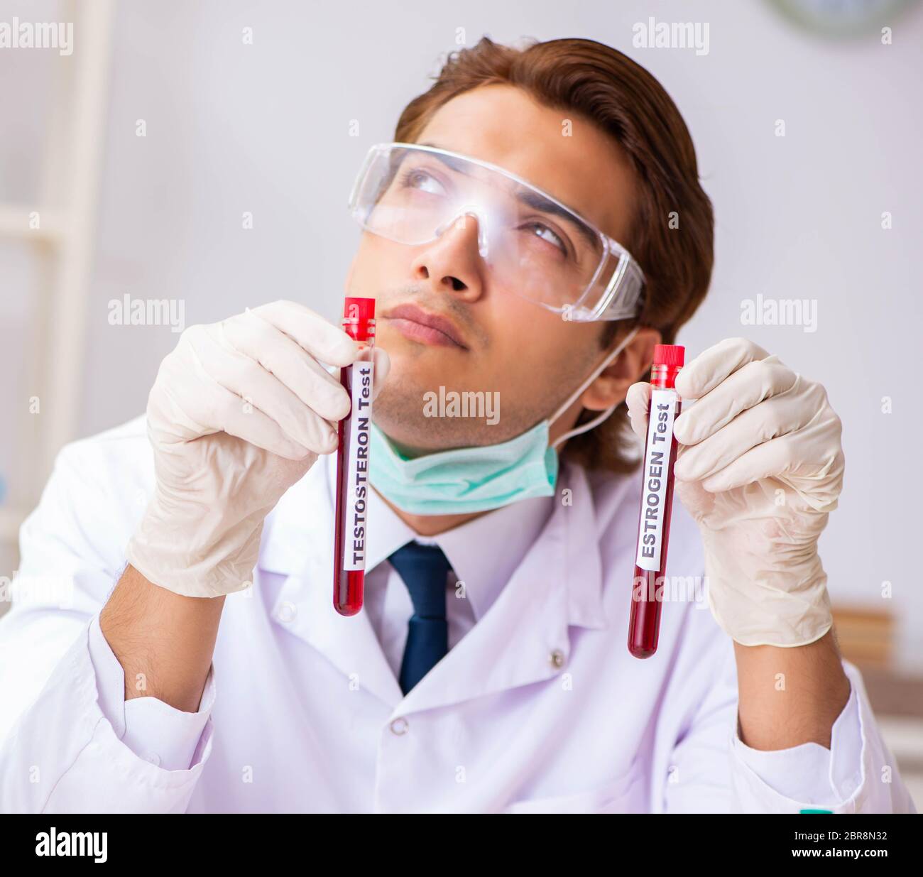 Female chemist checking blood hi-res stock photography and images - Alamy