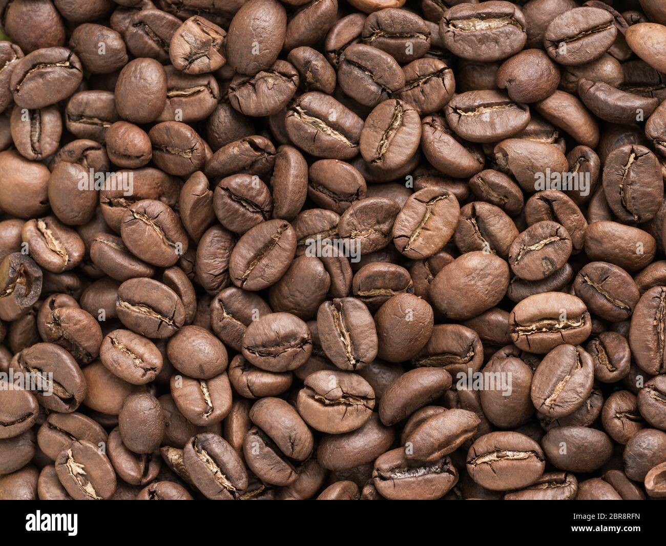 Coffee beans closeup background. Roasted coffee beans texture top view ...