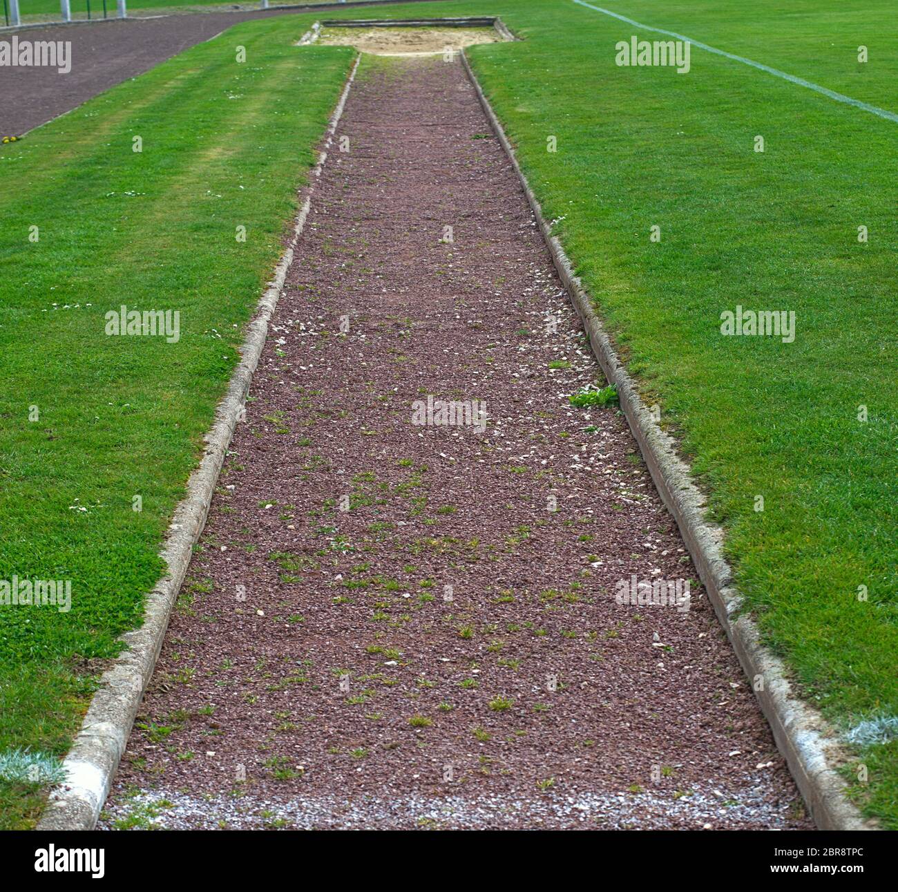 Long jump path on a stadium, front view Stock Photo - Alamy