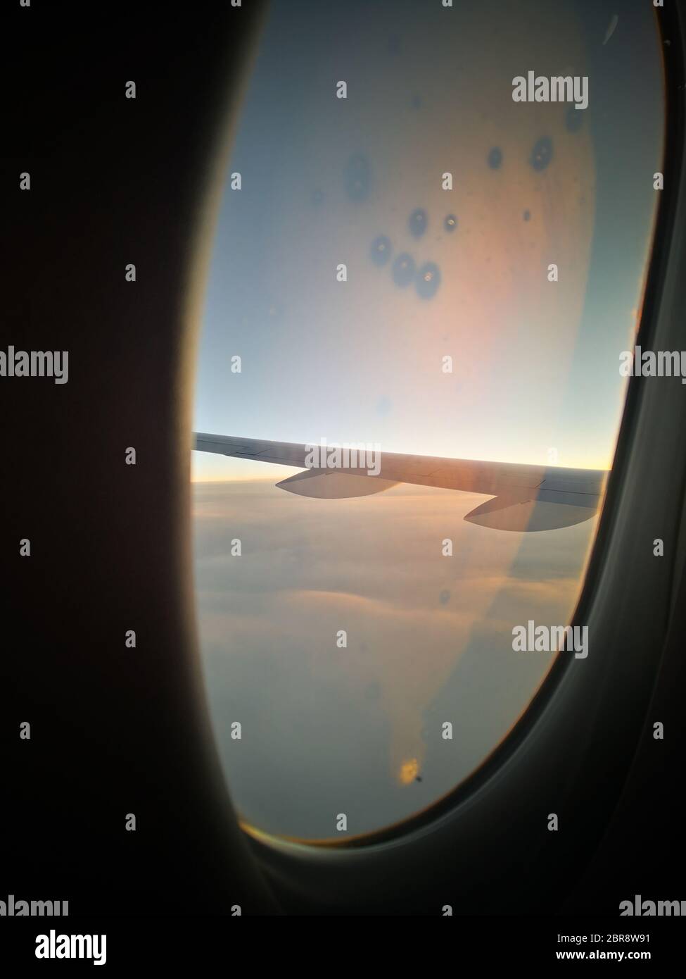 Color close up shot of a little hole in the window of a passenger ...