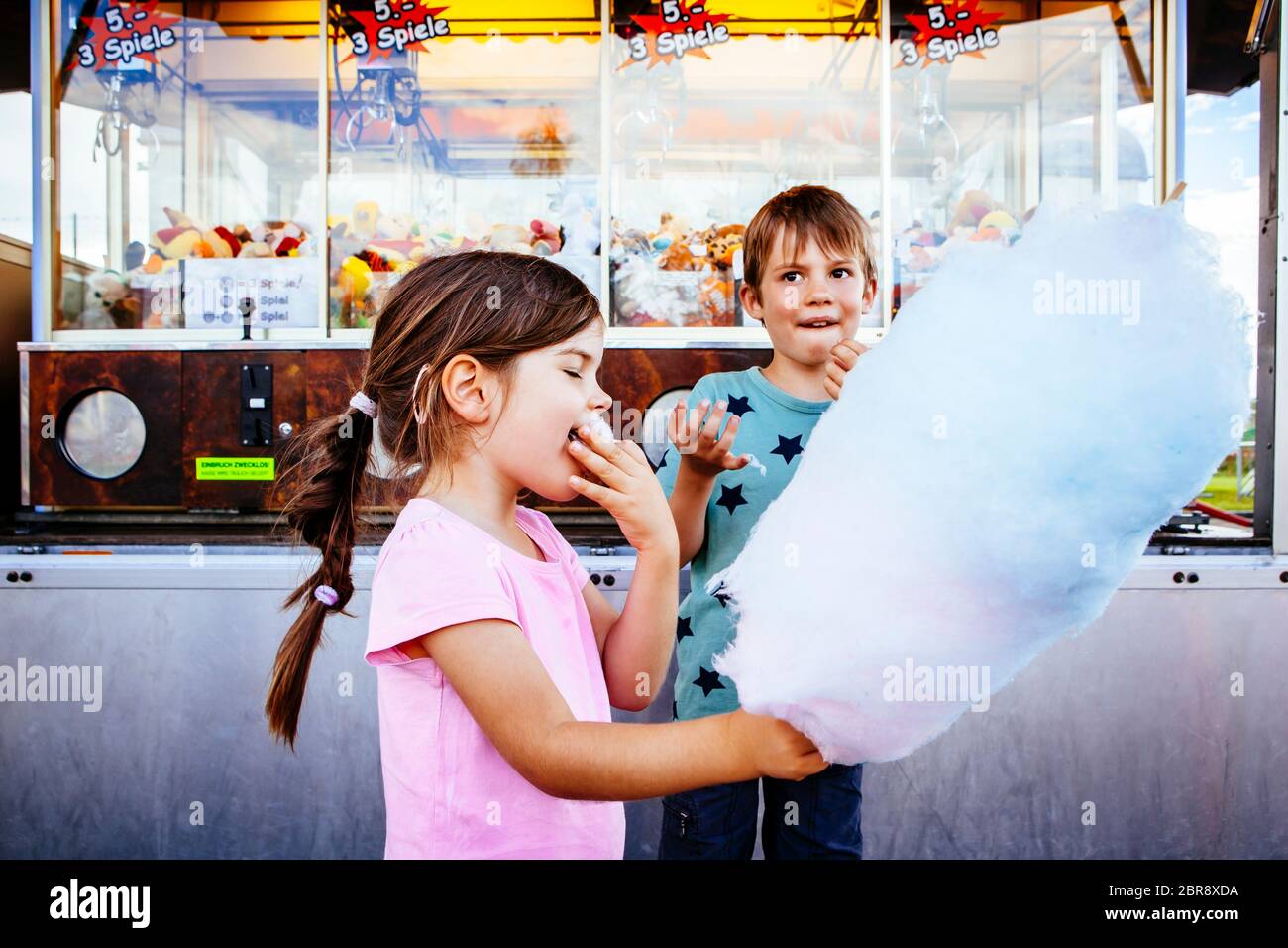 Child boy eating candy floss hi-res stock photography and images - Alamy