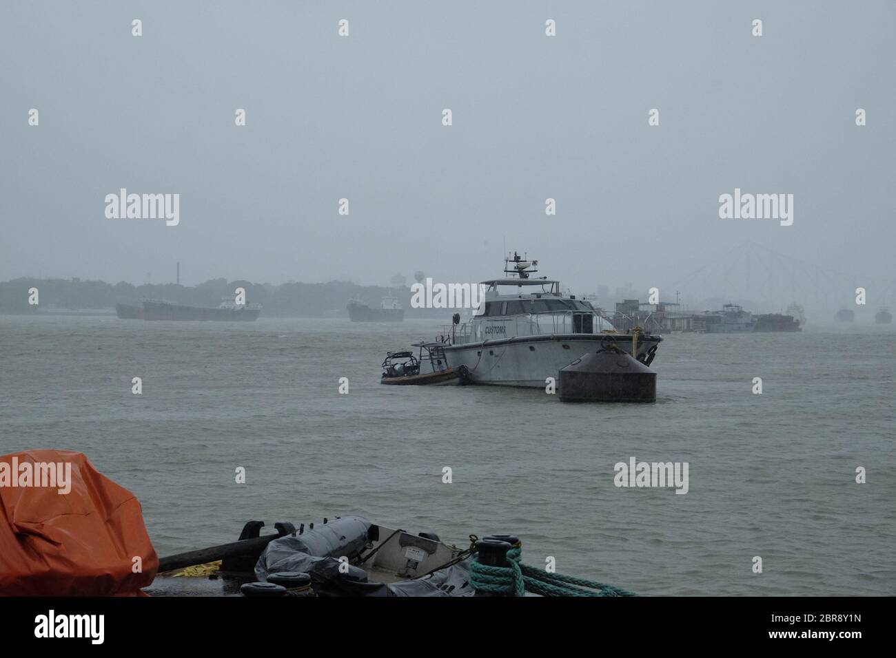 Kolkata, India. 20th May, 2020. Boats are anchored over the river ...
