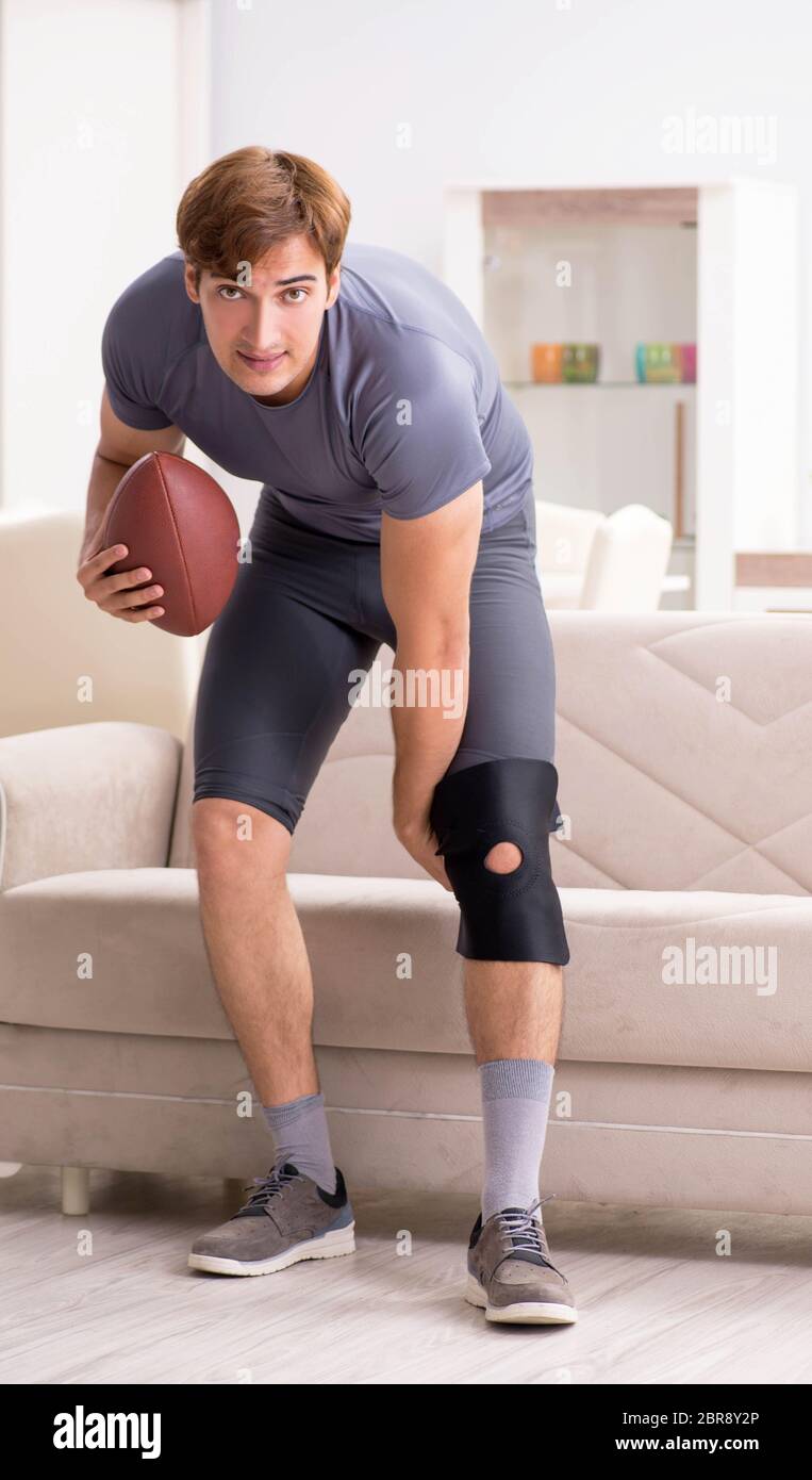 The injured man recovering at home from sports injury Stock Photo - Alamy