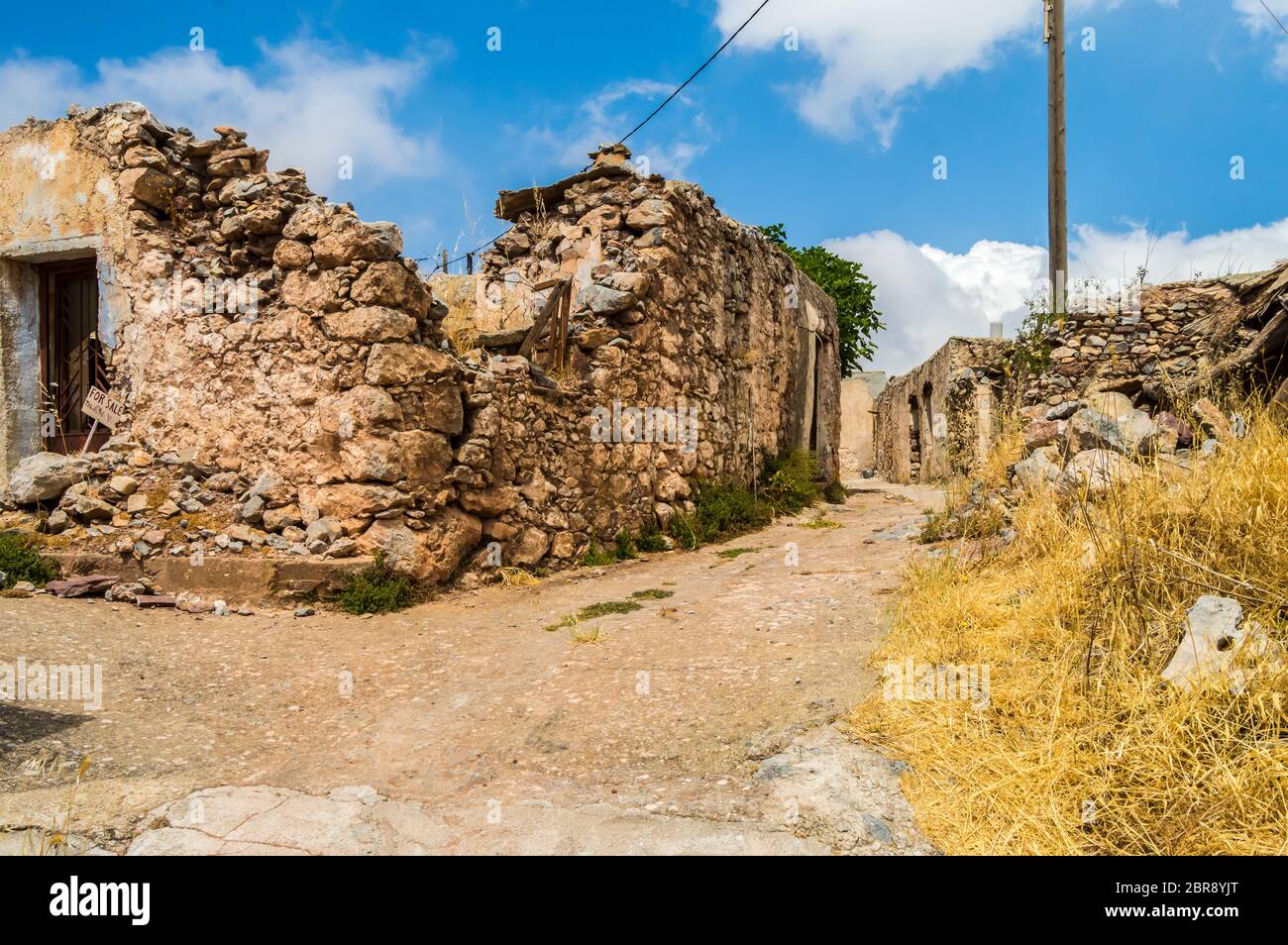 Old abandoned town. Narrow street in old Greek village. Traditional ...