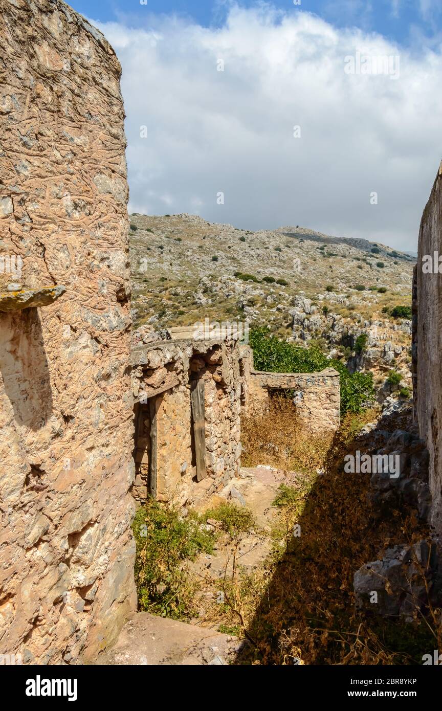 Old abandoned town. Narrow street in old Greek village. Traditional ...