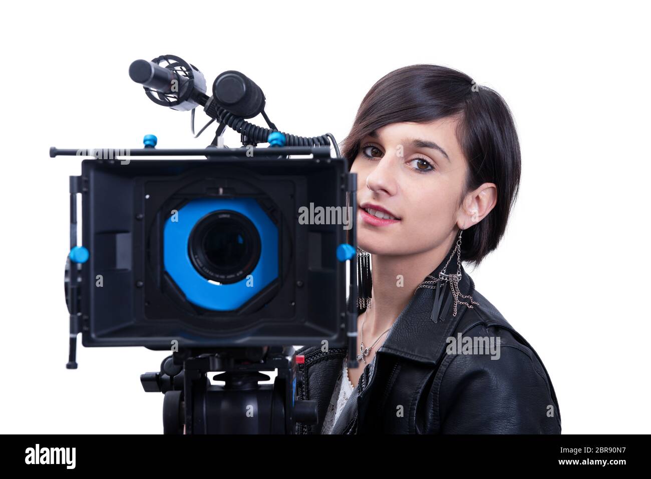 young woman with professional video camera, SLR, isolated on white ...