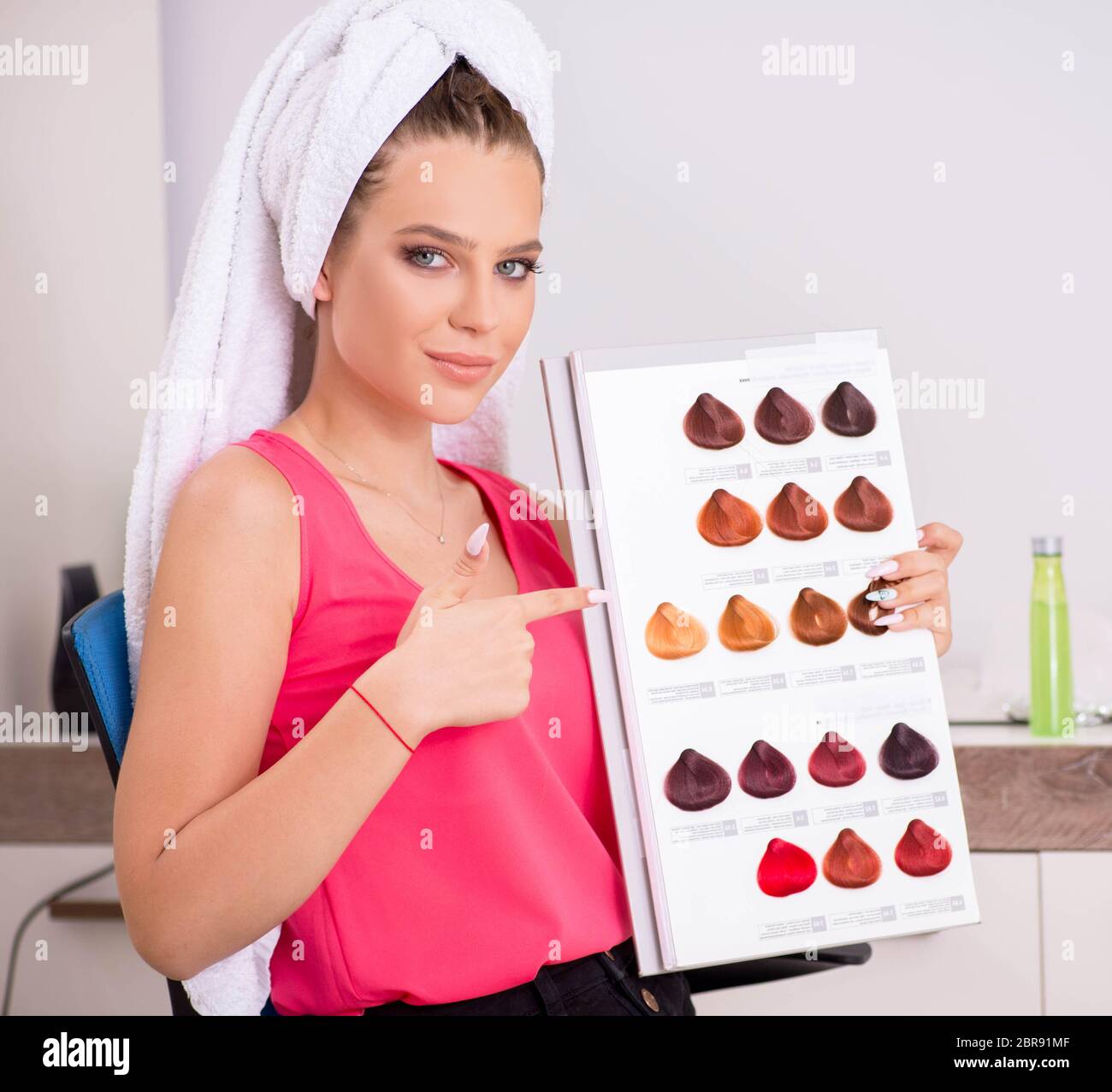 Female hairdresser showing haircut customer hi-res stock photography ...