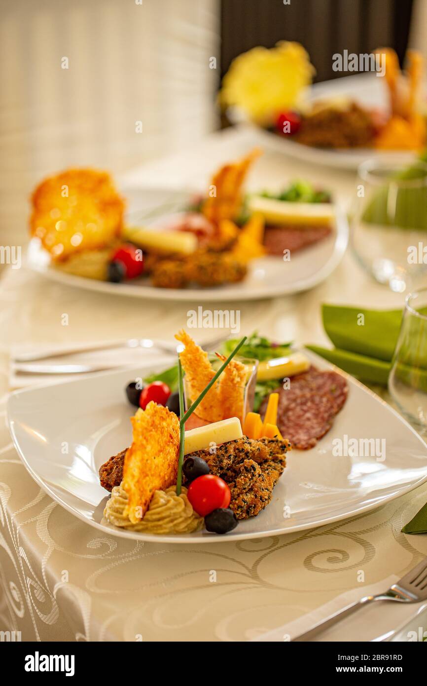 Delicious starter plate served on restaurant table Stock Photo - Alamy