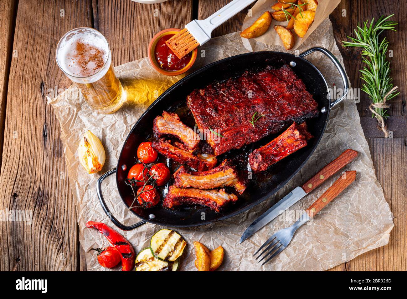 Grilled ribs in spicy marinade with salad and vegetables Stock Photo ...