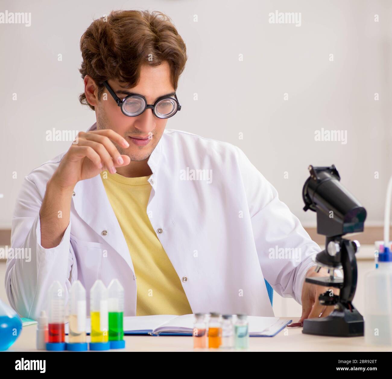 The funny crazy chemist doing experiments and tests Stock Photo - Alamy