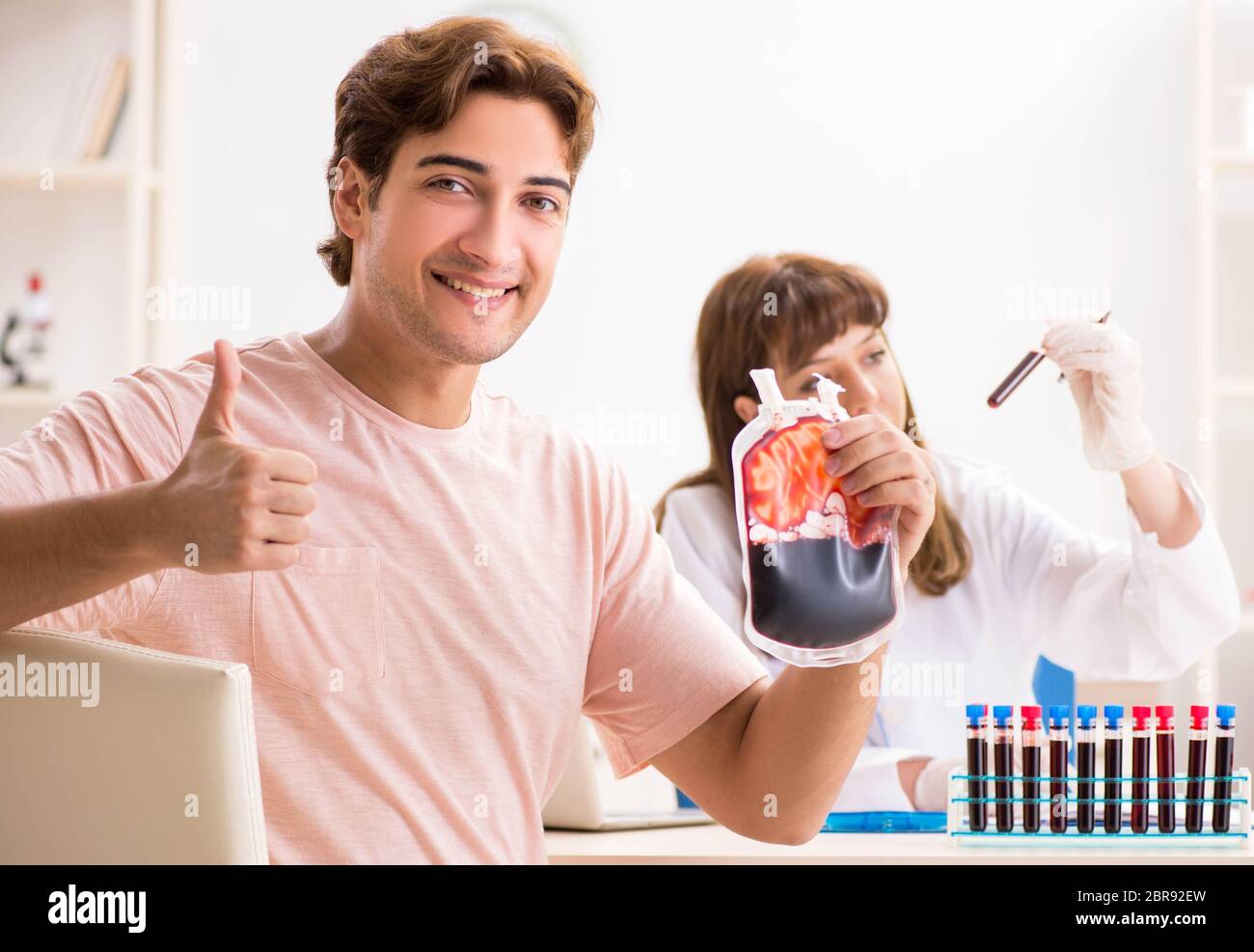 The man giving his blood as a donor Stock Photo - Alamy