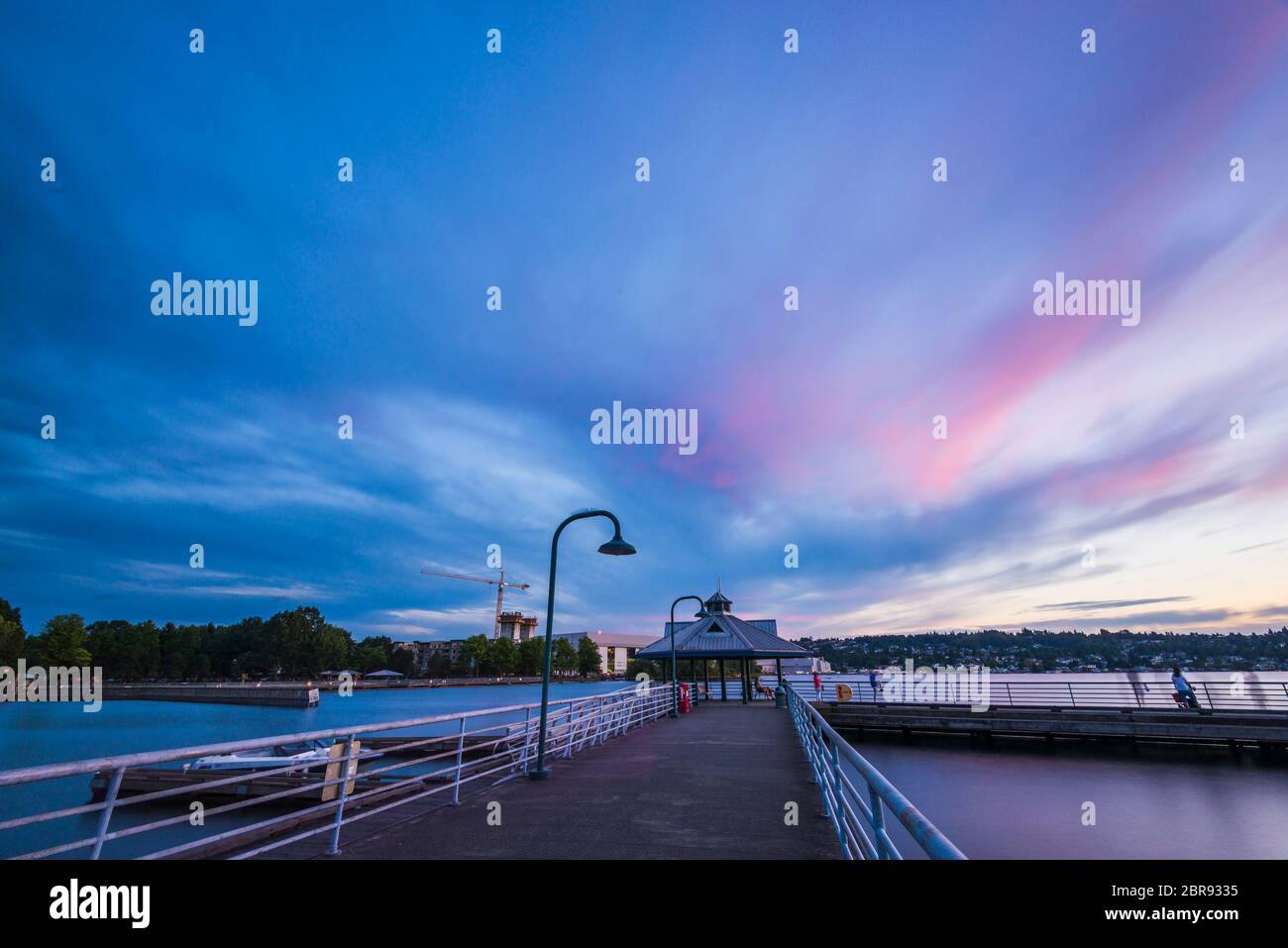 scene of walk way on the lake when sunset Stock Photo - Alamy