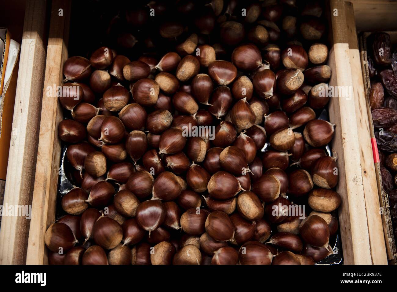 A close-up shot of an abundance of fresh Hazelnuts on display at a ...