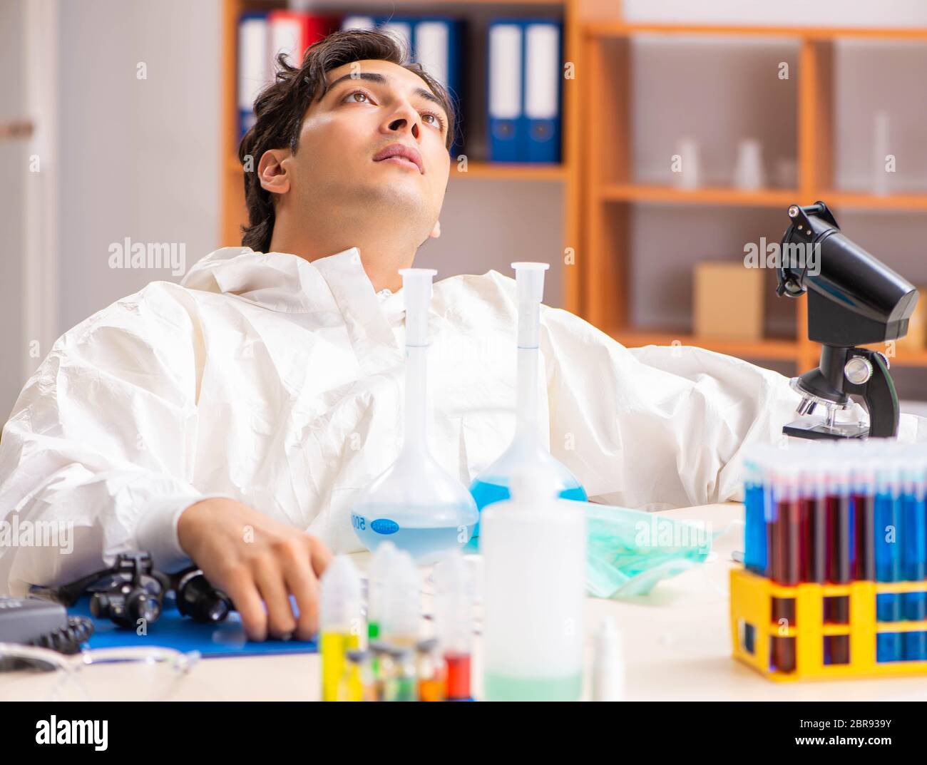 The young biochemist wearing protective suit working in the lab Stock ...