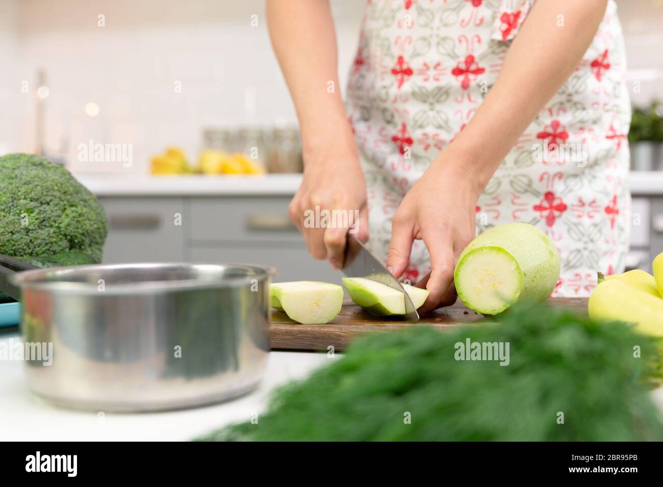 Woman preparing delicious and healthy food in the home kitchen. Healthy ...