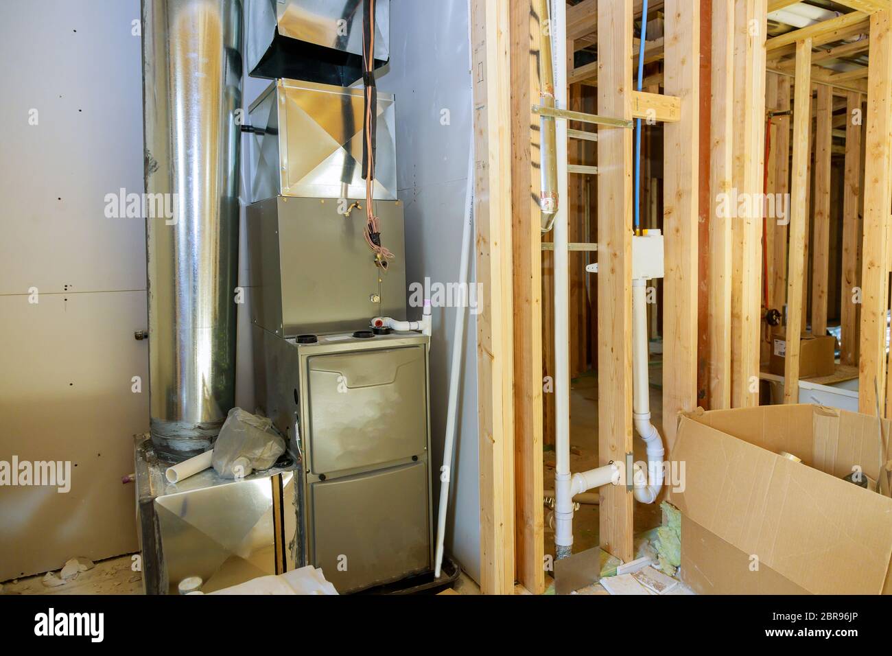 New home construction with installation of heating system in basement ...