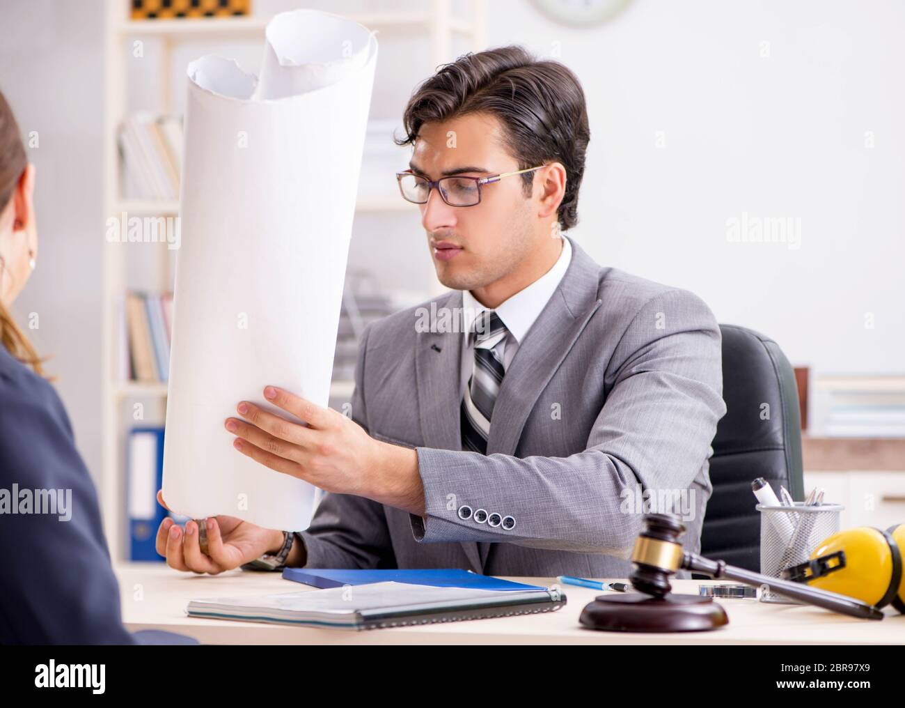 The lawyer talking to client in office Stock Photo - Alamy