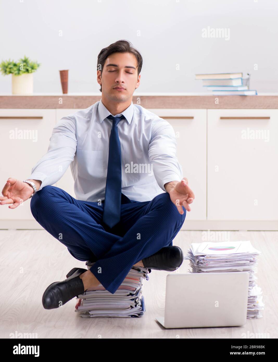 The extremely busy employee working in the office Stock Photo - Alamy