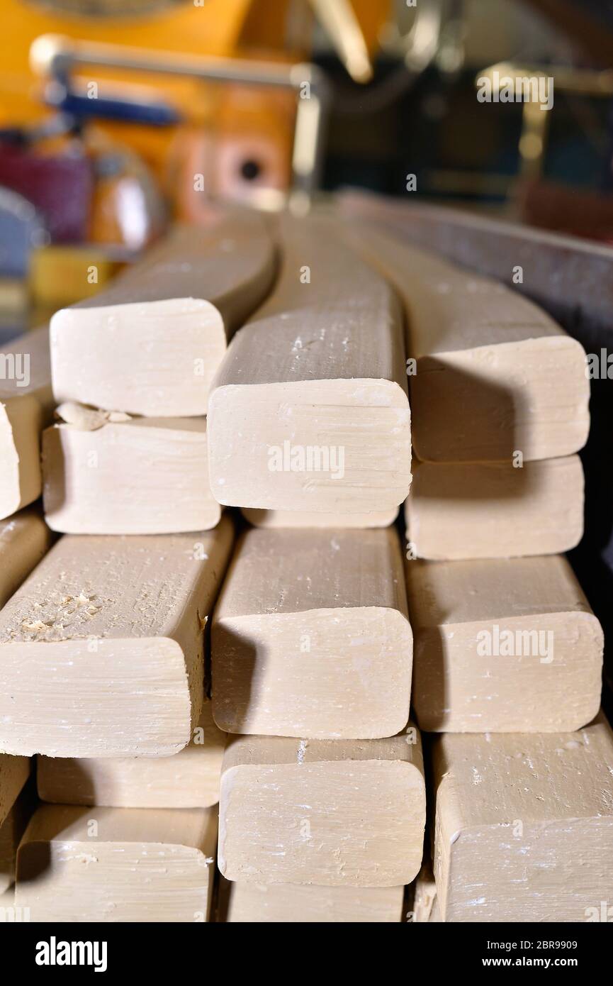 Pieces of soap on the assembly line at the plant for the production of ...