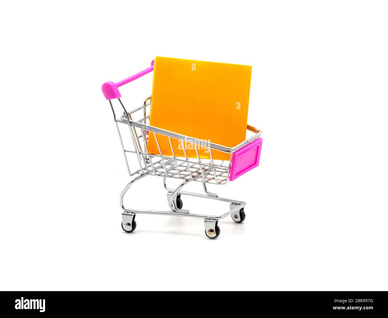 Sticky note and shopping cart isolated and white background Stock Photo ...