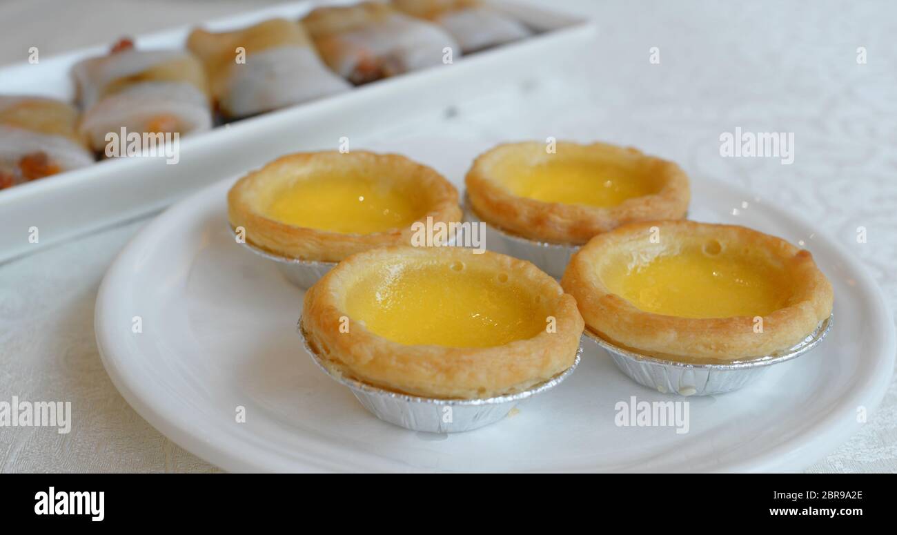 Egg tart dim sum in chinese restaurant Stock Photo - Alamy