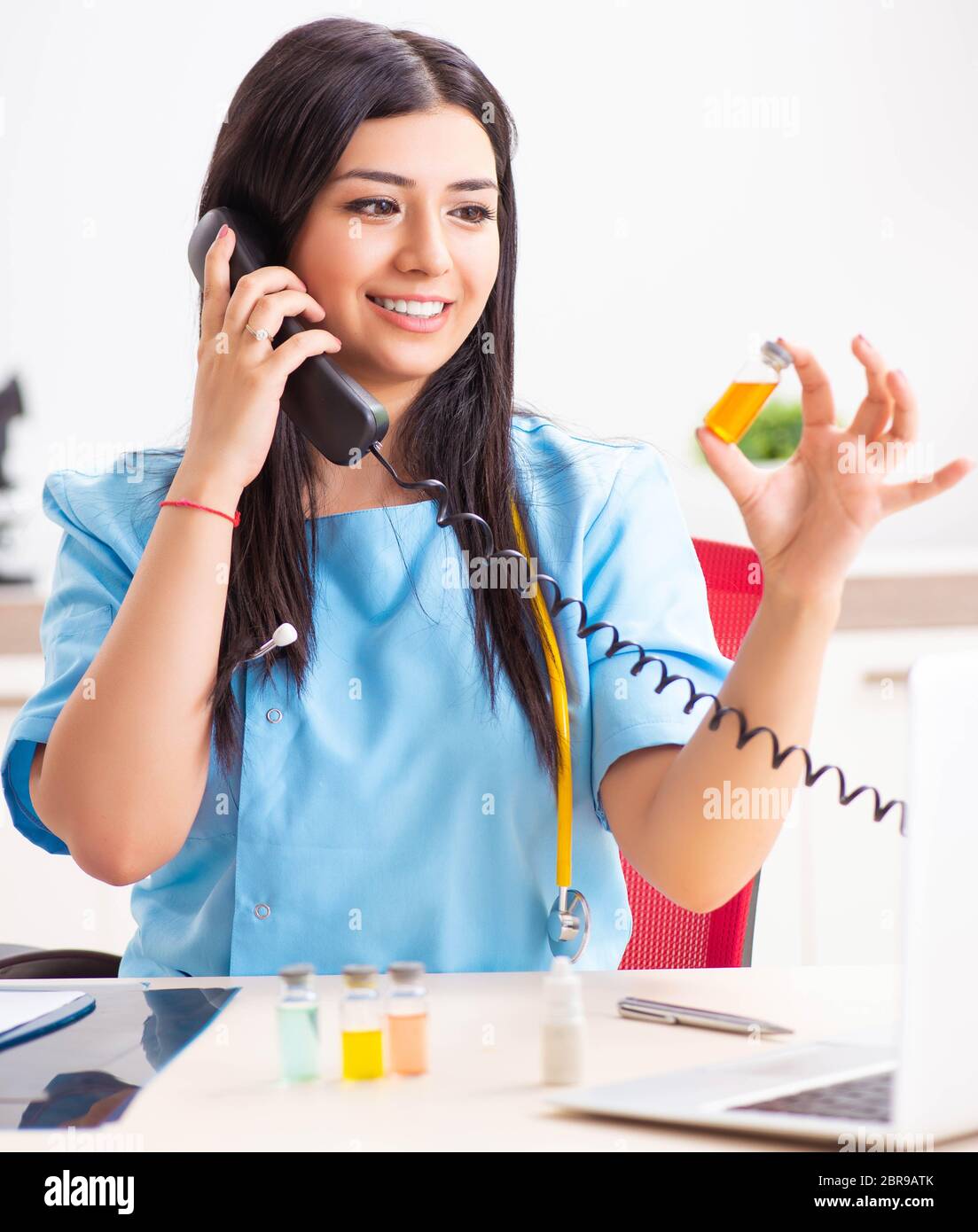 The young beautiful female doctor working in the clinic Stock Photo - Alamy