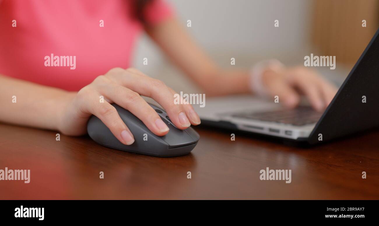 Woman work on computer with mouse at office Stock Photo - Alamy