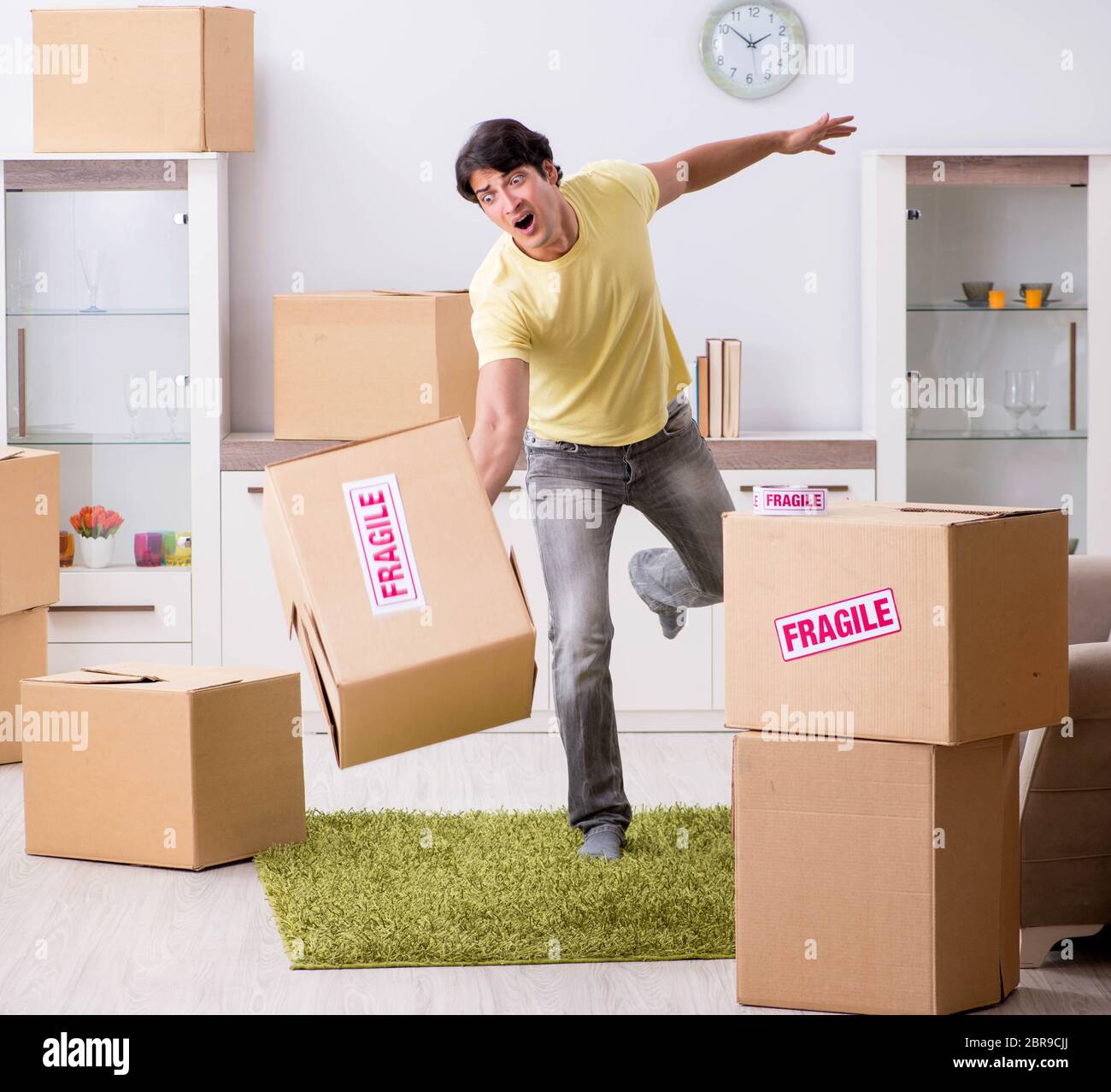 The man moving house and relocating with fragile items Stock Photo - Alamy