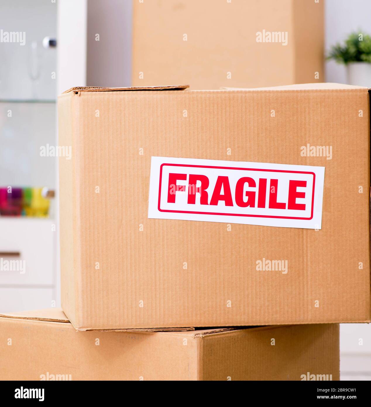 The man moving house and relocating with fragile items Stock Photo - Alamy