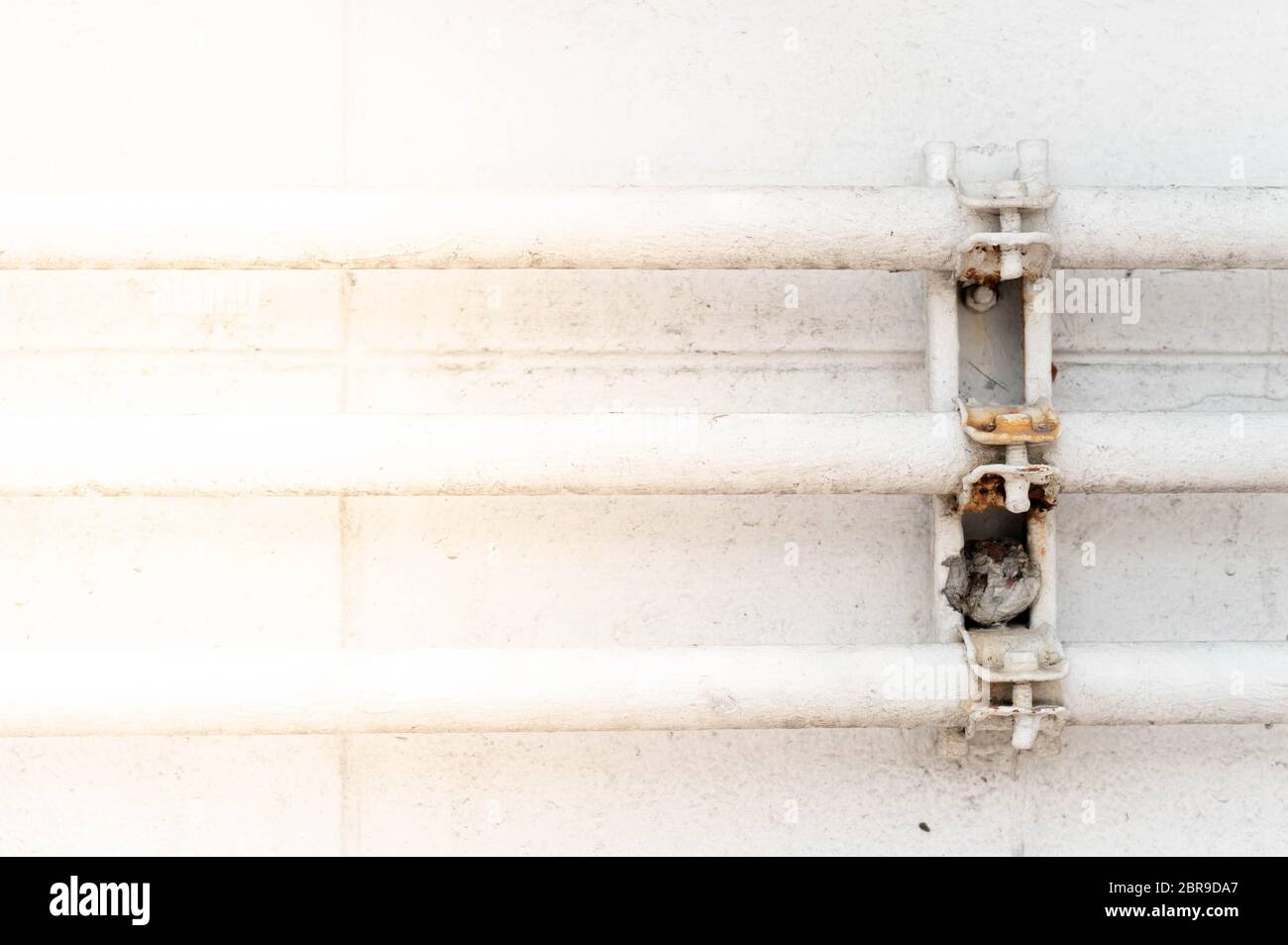 Three Industry pipe water with rust stick on the white wall at the ...
