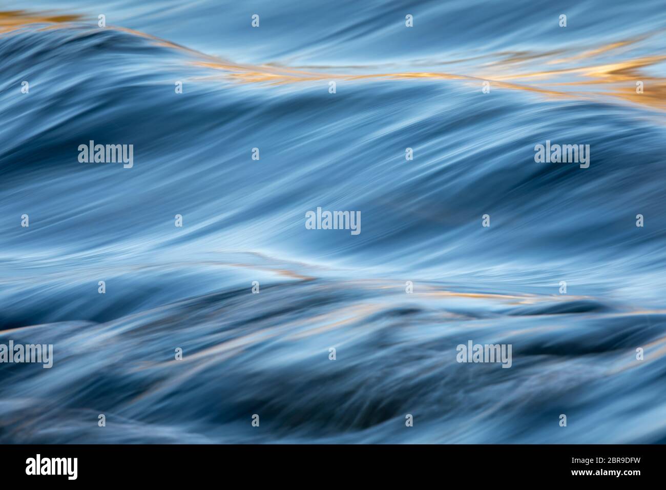 Water concept - river water flowing with light reflecting of its ...