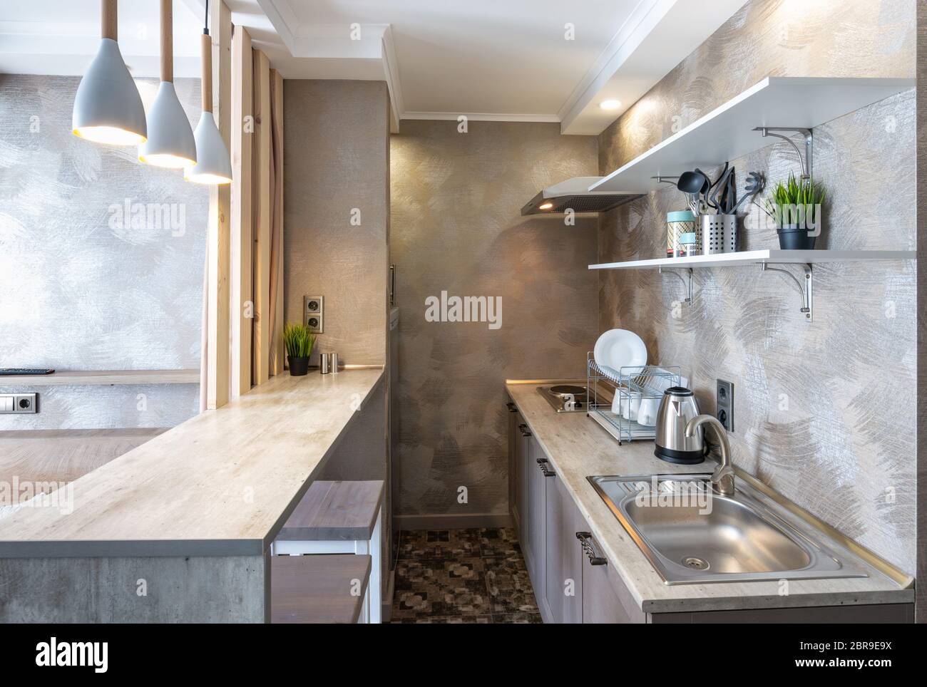 Kitchen interior in a small studio room Stock Photo - Alamy