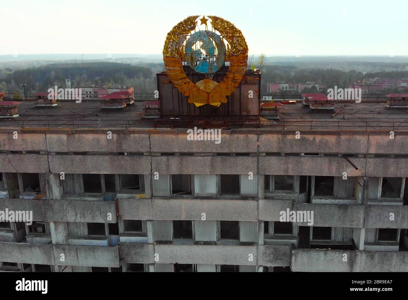 Soviet coat of arms on a high-rise building in Pripyat, view from above ...