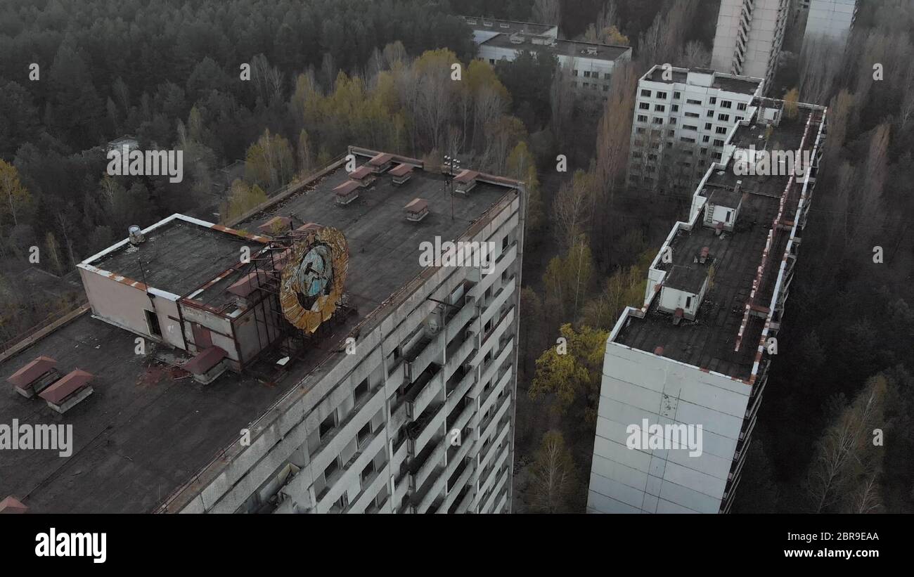 Soviet coat of arms on a high-rise building in Pripyat. City of Pripyt ...