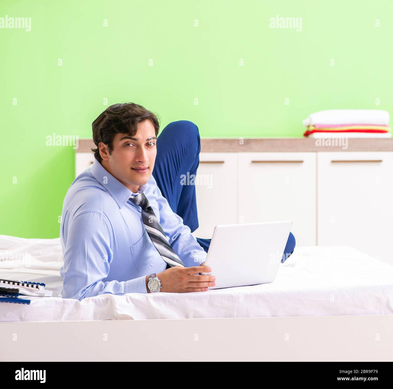 The businessman working overtime in hotel room Stock Photo - Alamy
