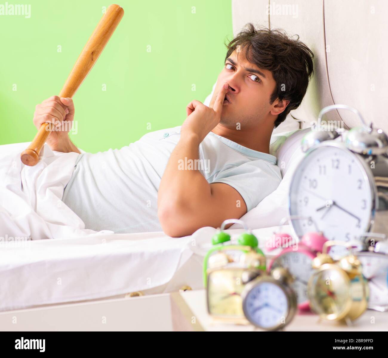 The young man having trouble waking up in early morning Stock Photo - Alamy