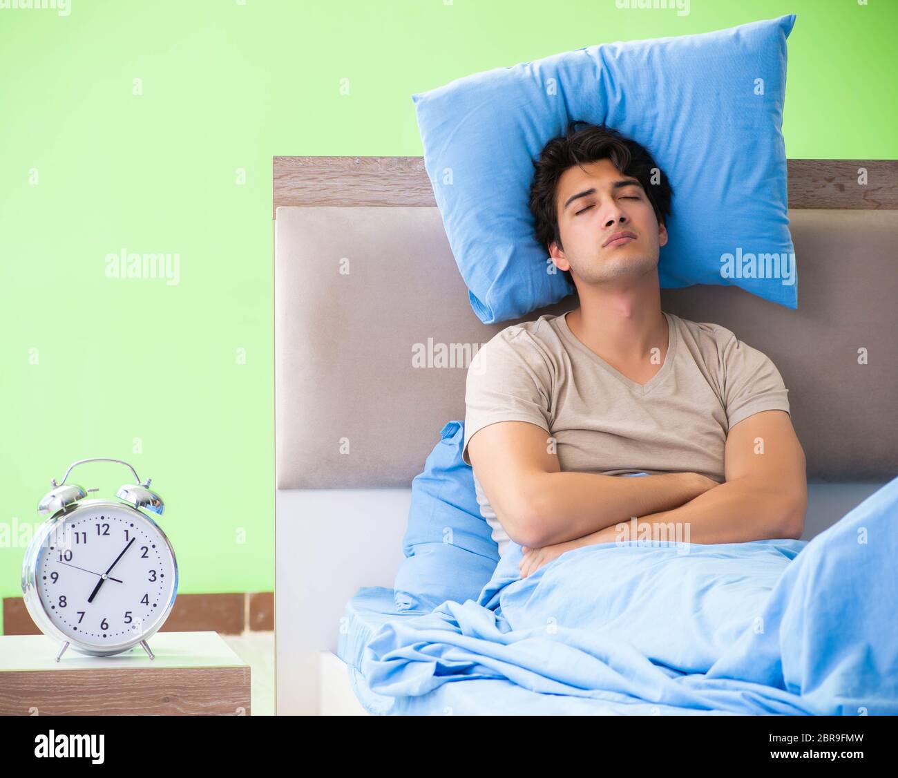 The man having trouble with his sleep Stock Photo - Alamy