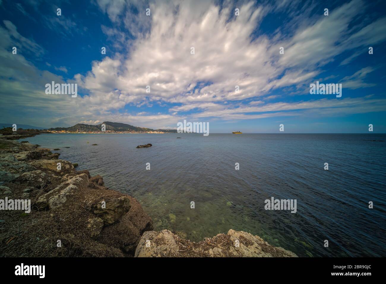 Wide angle shot of the rocky shore of Keri beach in summer on Zante ...