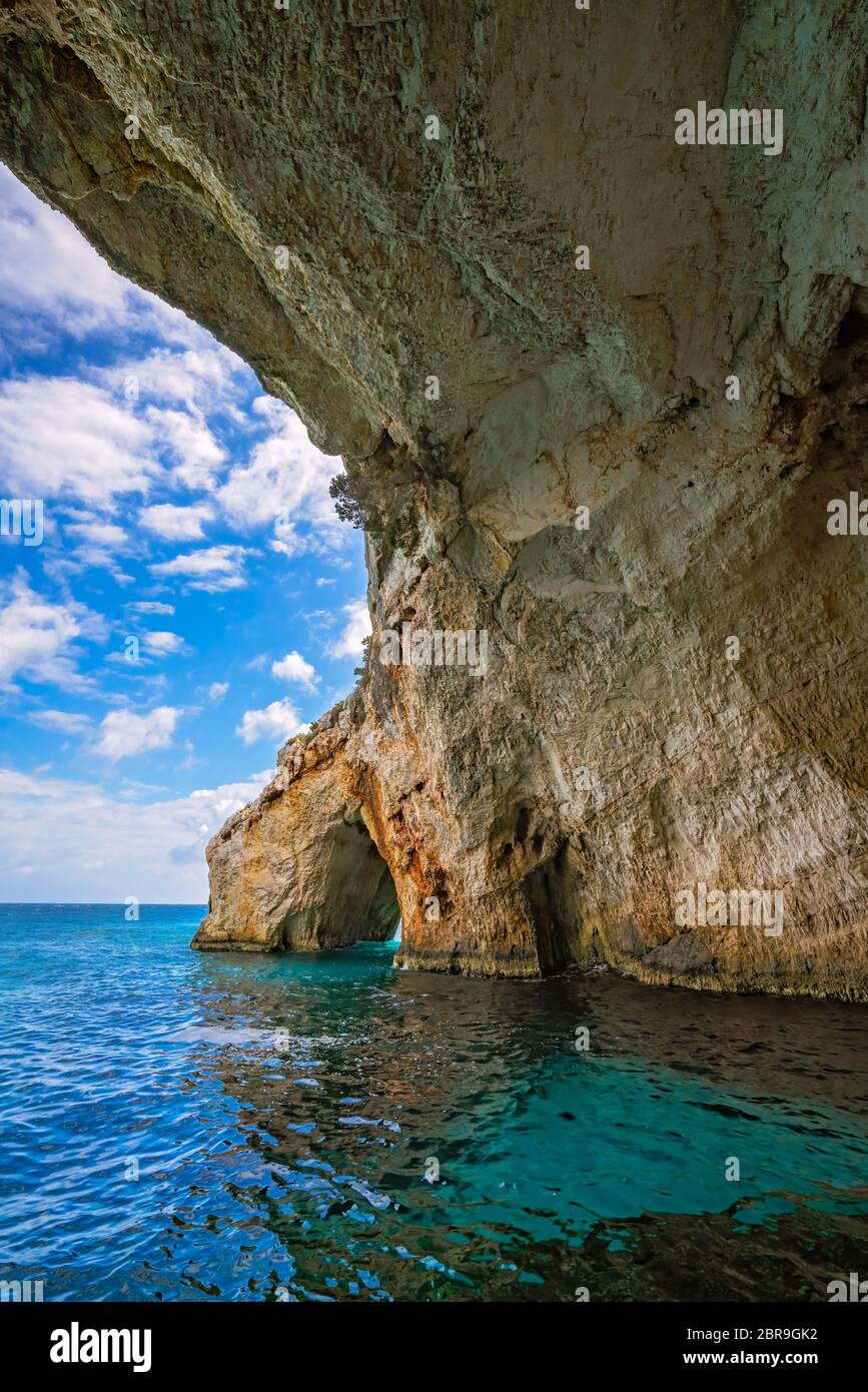 Stone arch entrance to one of the many Blue Caves in Zante Island ...