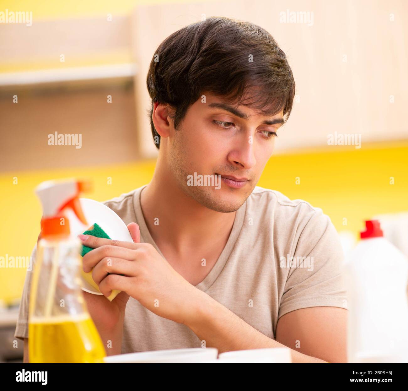 The man washing dishes at home Stock Photo - Alamy