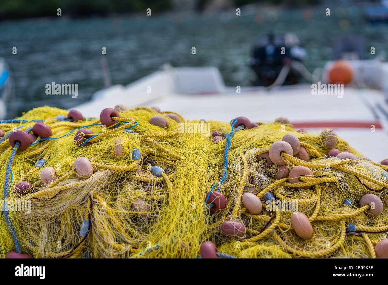 Pile of yellow fishing nets on a fisherman boat deck in Zante Island ...