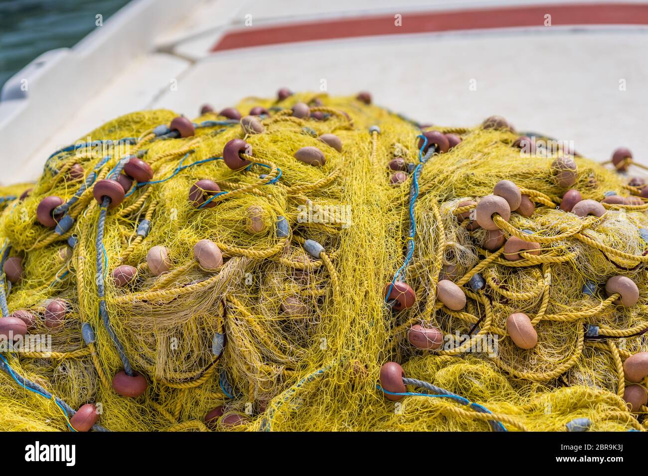 Pile of yellow fishing nets on a fisherman boat deck in Zante Island ...